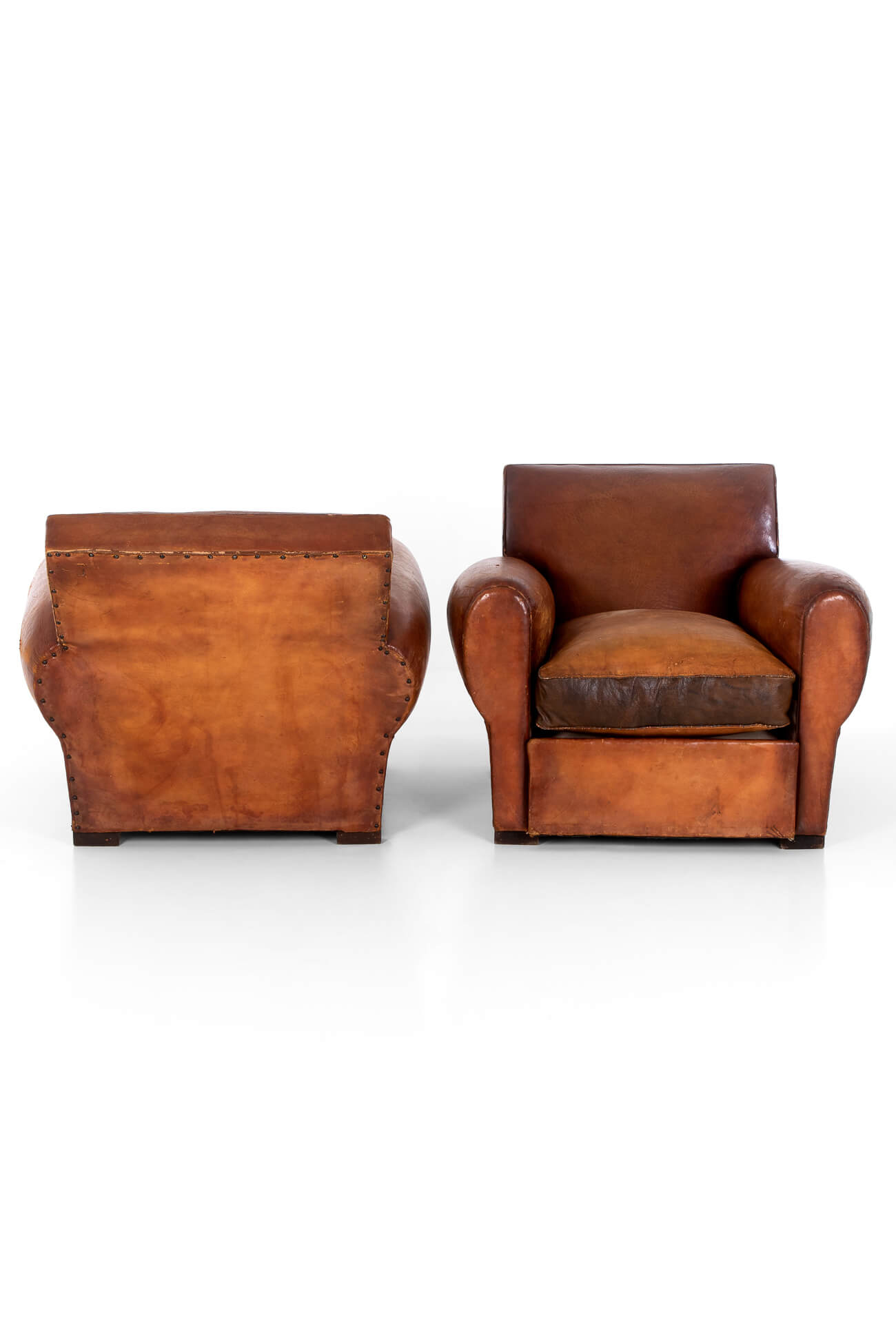 Pair of gang-box model club chairs | Pointers Antiques